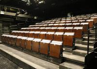 China Soft Retractable Granstands Power Operation With Padded Upholstered Seat Base for sale
