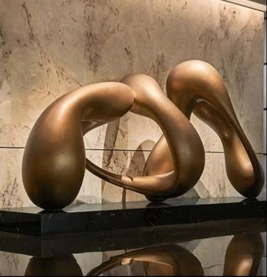 China Dynamic Fluid Gold Metal Sculpture Handcrafted Abstract Art For Garden Hotel Lobby for sale