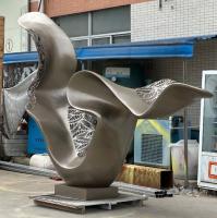 China Laser Cut Leaf Pattern Abstract Metal Sculpture With Wave Design Modern Stainless Steel Art for sale