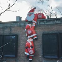 China AMIG 3D FRP Santa Claus Climbing Sculpture Silk Screen Printed Christmas Decoration for Building Facade and Mall Exteriors for sale