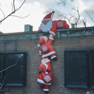 China AMIG 3D FRP Santa Claus Climbing Sculpture Silk Screen Printed Christmas Decoration for Building Facade and Mall Exteriors for sale