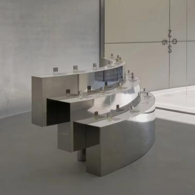 China Custom Stainless Steel Water Wave Sculpture Reception Desk For Luxury Hotel Lobby for sale