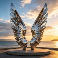 China 304 Stainless Steel Angel Wings Sculpture with Mirror Polished Finish and Hollow Feather Structure for sale