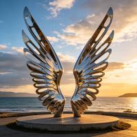 China 304 Stainless Steel Angel Wings Sculpture with Mirror Polished Finish and Hollow Feather Structure for sale