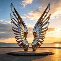 China 304 Stainless Steel Angel Wings Sculpture with Mirror Polished Finish and Hollow Feather Structure for sale