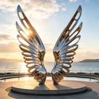 China 304 Stainless Steel Angel Wings Sculpture with Mirror Polished Finish and Hollow Feather Structure for sale