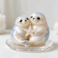 China Pastel Glitter Pair Seal Resin Figurine with Starfish, Hand-Finished Resin Sculpture for Tabletop Ornament Display for sale