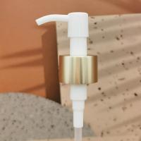 China 24/410 Long Nozzle Plastic Cosmetic Lotion Pump Gold Aluminum Closure Metal Shell With Clip for sale