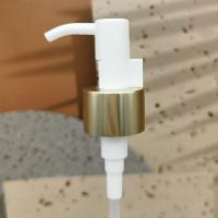 China 24/410 Long Nozzle Plastic Cosmetic Lotion Pump Gold Aluminum Closure Metal Shell With Clip for sale