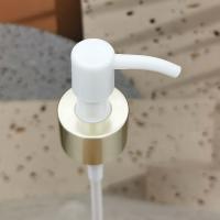 China 24/410 Long Nozzle Plastic Cosmetic Lotion Pump Gold Aluminum Closure Metal Shell With Clip for sale