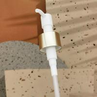 China 24/410 Long Nozzle Plastic Cosmetic Lotion Pump Gold Aluminum Closure Metal Shell With Clip for sale