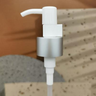 China 24/410 Plastic Cosmetic Lotion Oil Pump Silver Aluminum Closure Metal Shell With Clip for sale