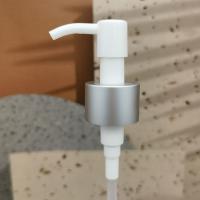 China 24/410 Plastic Cosmetic Lotion Oil Pump Silver Aluminum Closure Metal Shell With Clip for sale