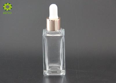China 30ml Clear Glass Empty Cosmetic Bottles Square Shape For Essential Oil / Lotion for sale