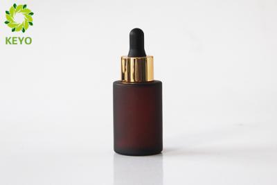 China Round Amber Color Glass Foundation Bottle 30ml With Golden Plastic Dropper for sale