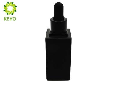 China Leak Proof Matte Black Glass Empty Cosmetic Bottles 1 OZ For Essential Oil / Serum for sale