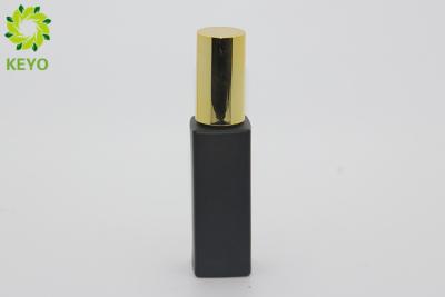 China Matte Black Glass Liquid Foundation Packaging Bottle 30ml With Gold Pump Cap for sale