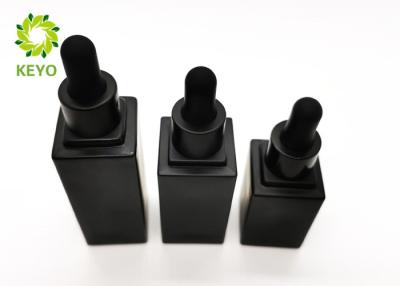 China Matte Black Glass Empty Cosmetic Bottles For Essential Oil / Serum 20ml 30ml 50ml for sale