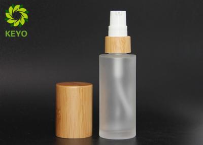 China Bamboo Cap Skin Care Empty Cosmetic Bottles Frosted Glass Bottle With White Pump for sale