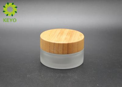 China Compact Frosted Glass Cosmetic Bottles And Jars For Cream With Bamboo Lid for sale