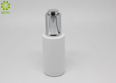 China 1OZ White Round Glass Mini Essential Oil Bottles With Silver Push Button Dropper for sale