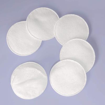 China Lint Free Non Woven Cotton Pads Single Use Soft Cotton Pads 58 MM for sale