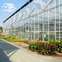 China Wind Resistant Glass Greenhouse With Transparent Panels And UV Protection for sale