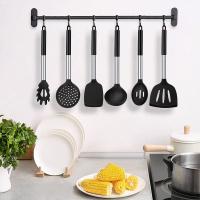 China Silicone Nonstick Kitchen Utensil Set 5 Piece Heat Resistant Spatula Spoon for Frying Fish Leak for sale
