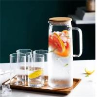 China Thickened High Borosilicate Glass Juice Zapper 1L Cold Water Jug with Stainless Steel Lid for sale