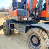 China Transport Length 9.445m Doosan DX210W Used Excavator with 0.92m3 Bucket Capacity for sale