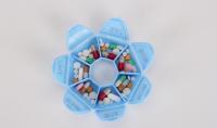 China 7 Compartment Weekly Pill Organizer Round Shape Plastic Pill Container Travel Medicine Box for sale