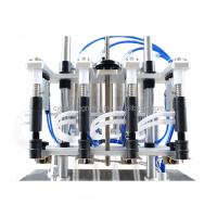 China Semi Automatic Vacuum Filler 4 Nozzles 220V 304 Stainless Steel Liquid Bottle Filling Machine for sale