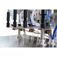 China Semi Automatic Vacuum Filler 4 Nozzles 220V 304 Stainless Steel Liquid Bottle Filling Machine for sale