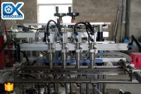 China 4 Head Gravity Bottle Filler 5-5000ml Automatic Liquid Filling Machine for Juice Glycerin for sale