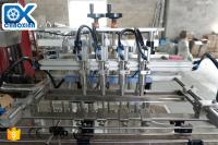 China 4 Head Gravity Bottle Filler 5-5000ml Automatic Liquid Filling Machine for Juice Glycerin for sale