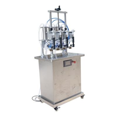China Semi Automatic 4 Nozzle Vacuum Bottle Filler 10-1000ml for Wine Vodka Whisky for sale