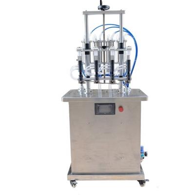 China Semi-Automatic Vacuum Liquid Filling Machine 4 Nozzles 150W for Perfume Olive Oil Glass Bottles for sale