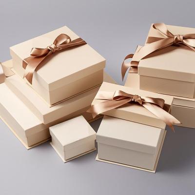 China Debossing Gift Boxes Packaging Ribbon Closure Included Various Sizes Perfect for Stylish Packaging and Gift Presentation for sale