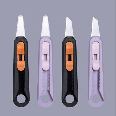 China Ceramic Utility Knife with Sawtooth Edge Handle 32mm Blade Retractable Safety Cutter for sale
