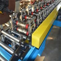 China Octagonal Tube Roller Shutter Door Roll Forming Machine With Saw Cutting for sale
