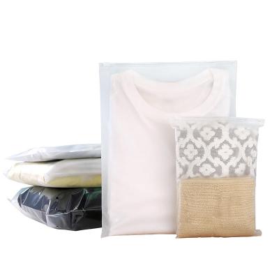 China Customized logo zipper design LDPE polyethylene plastic bag matte frosted transparent clothing, shoes and socks intaglio printed zipper seal for sale