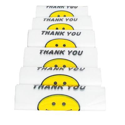 China Wholesale Direct T-Shirt Vest Carrier Bag Clear PE LDPE Shopping Bag Customized Smiling Face Plastic Bag for sale