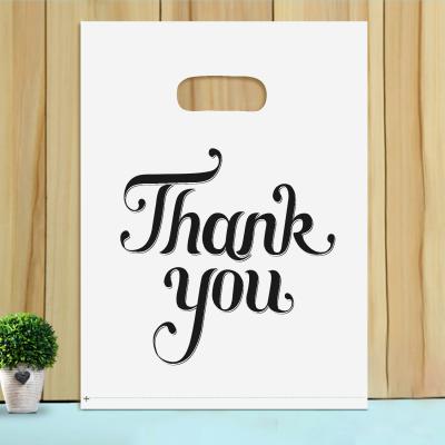 China Factory stock four-finger flat pocket small size plastic bag clothing store bag gift bag packaging bag clothes handbag plastic gift bag Printed HDPE Hand Hole Plastic Bags, Custom Logo Shopping Carry for sale
