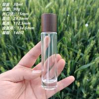 China 50ml 100ml Perfume Spray Atomizer Bottle Bayonet Long Cylinder Wood Cap Glass for sale