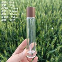 China 50ml 100ml Perfume Spray Atomizer Bottle Bayonet Long Cylinder Wood Cap Glass for sale