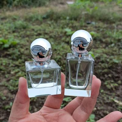 China Refillable 30ml Perfume Spray Bottle Crystal White Thick Bottom Polished Glass for sale