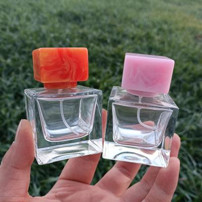 China Square 50ml Perfume Spray Bottle Bayonet Resin Cap Glass Flat Round for sale
