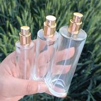 China 100ml Perfume Spray Atomizer Bottle Glass Empty Cylindrical Wooden Lid for sale
