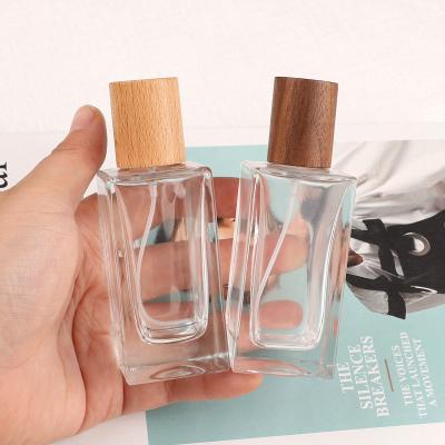 China Walnut Scented Water Perfume Spray Bottle Portable 30ml 50ML Glass for sale