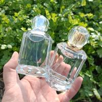 China Crystal White Glass Perfume Bottle 100ml Vertical Stripe Cylindrical Bayonet for sale